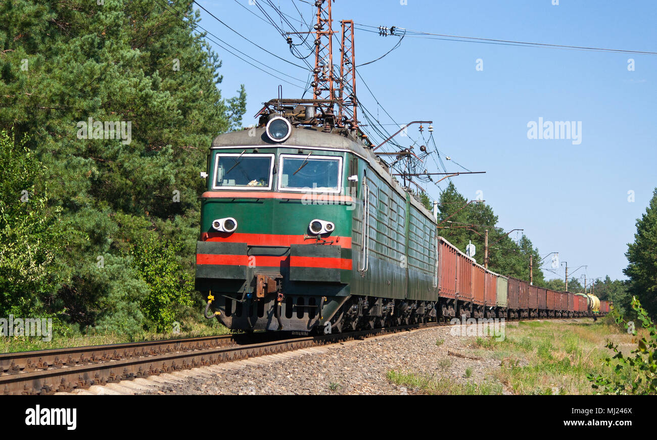 Freight train hauled by electric locomotive Stock Photo - Alamy