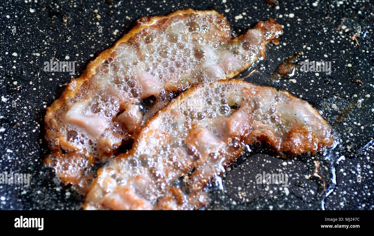 Close-up of a Bacon Fried On Grill Stock Photo - Alamy