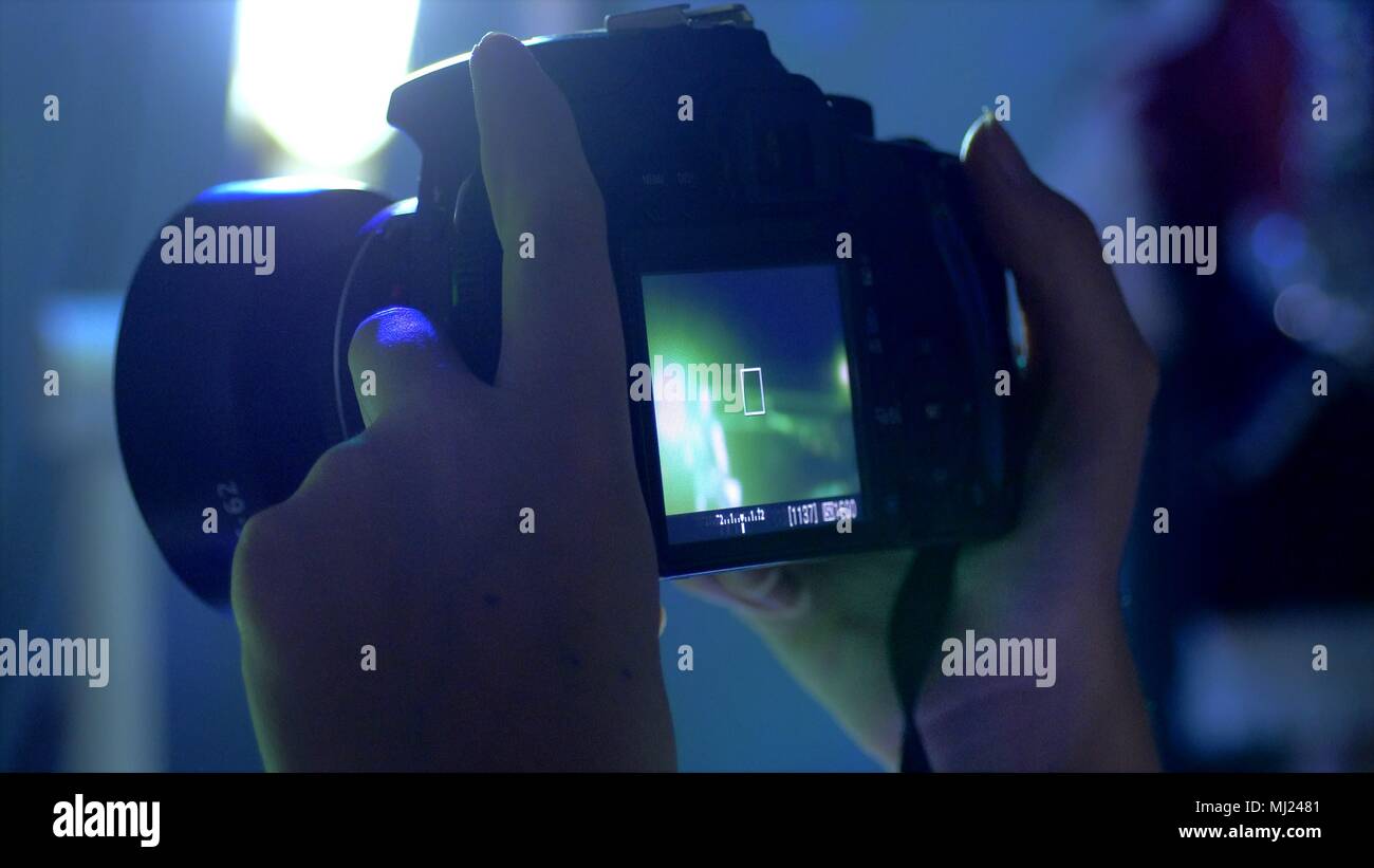 Spectator Girl Shooting On Camera Stock Photo - Alamy