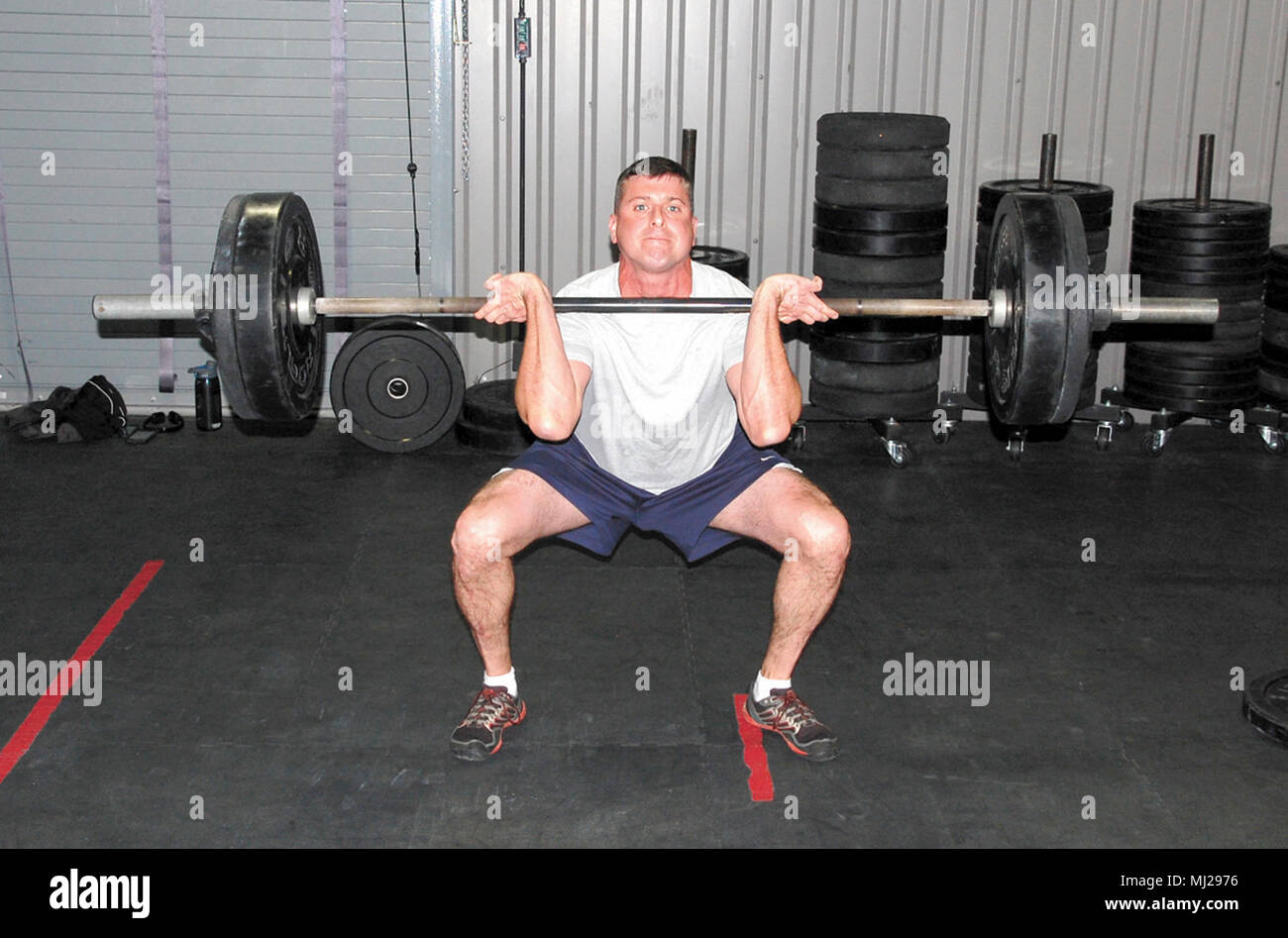 Chris Ingenloff demonstrates proper squat technique. Image collection ...