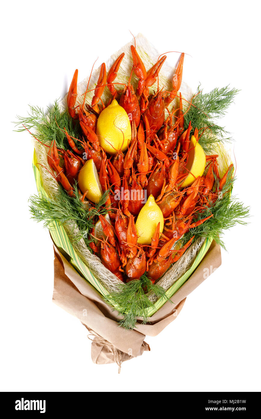 Bouquet of bright red boiled crawfish with dill and lemon on a white ...