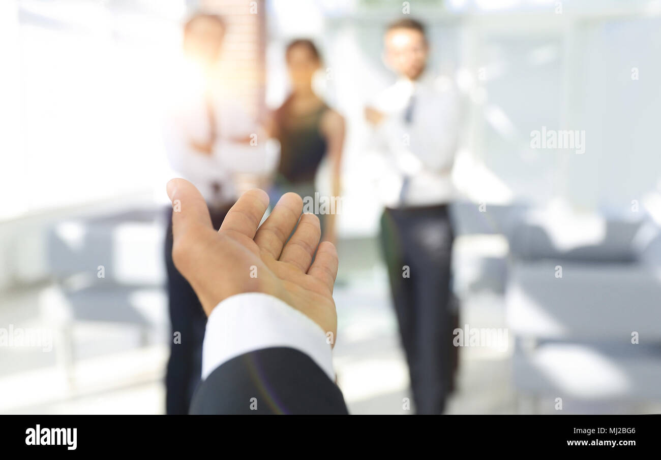 background image of businessman holding out hand for a handshake Stock ...
