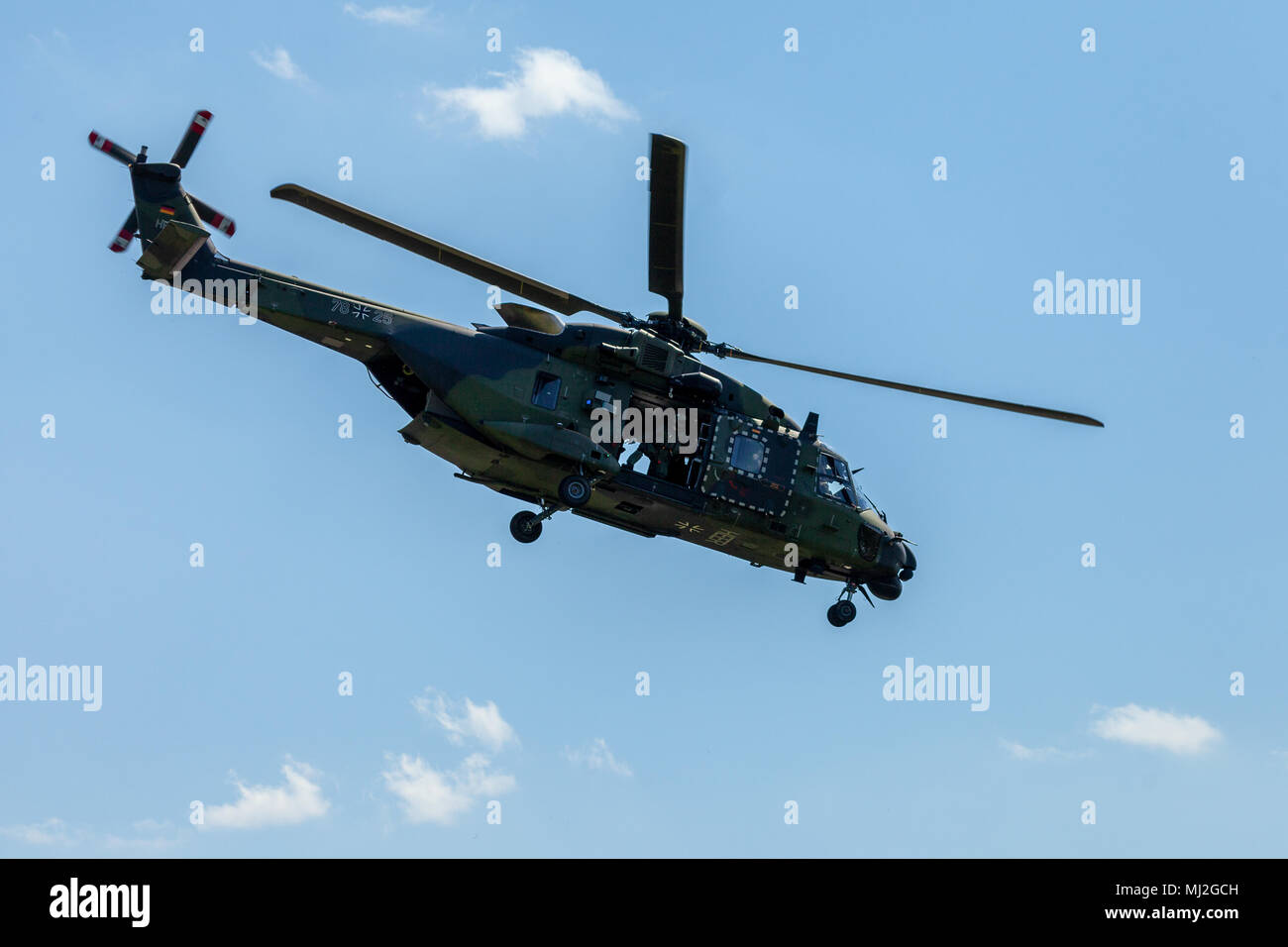 BERLIN / GERMANY - JUNE 28, 2018: german military transport helicopter, NH 90 flies on airfield ...