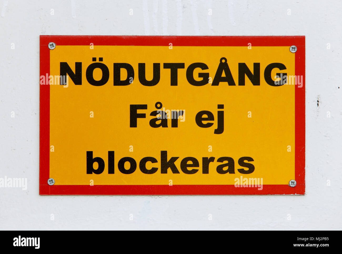 Sign in Swedish, Emergency exit must not be blocked Stock Photo - Alamy