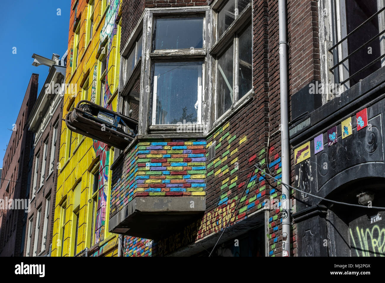 Spuistraat, squatters houses. Conveyor belt coming out from a window ...
