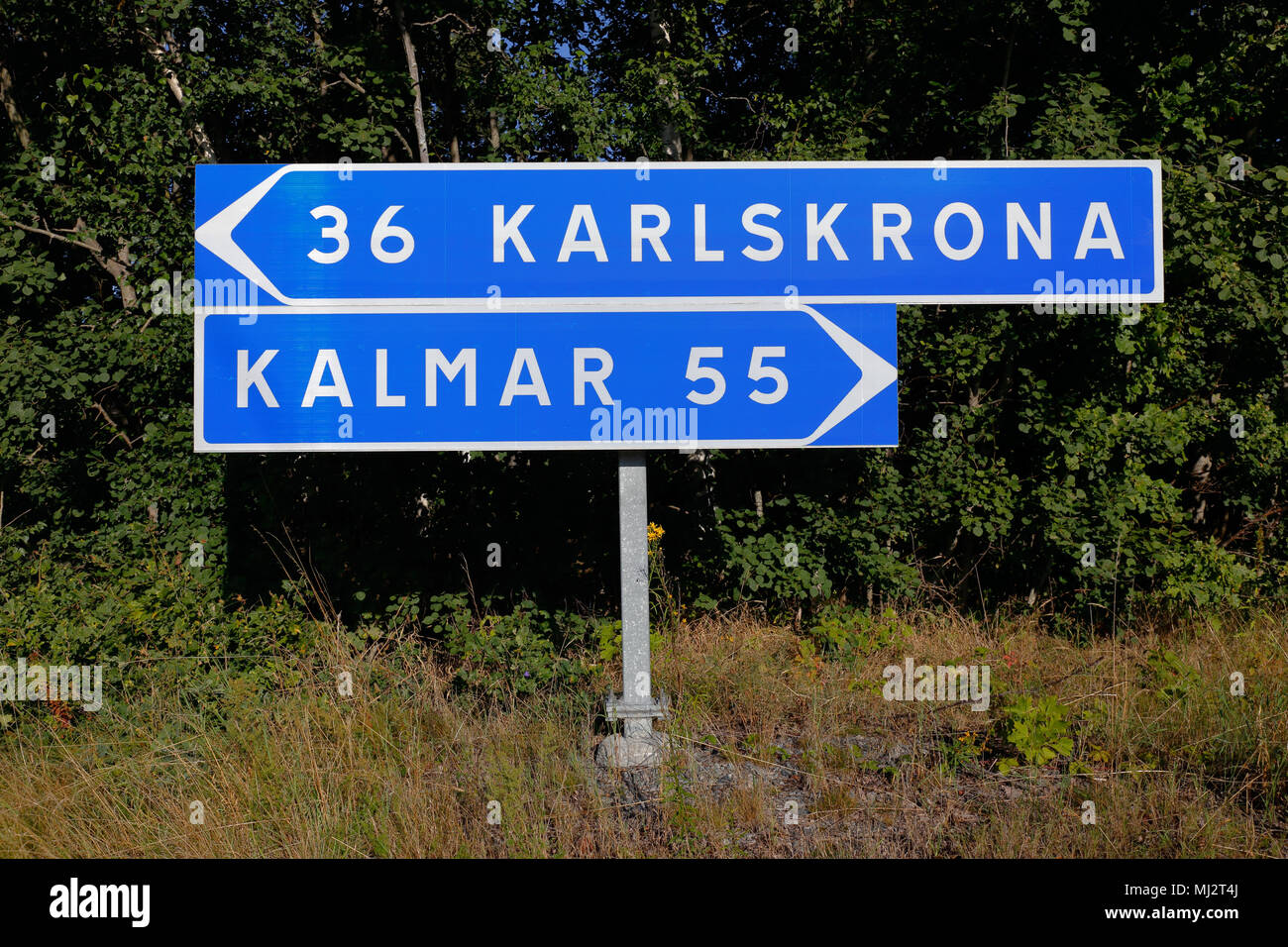 Signpost with distances and directions to the two Swedish citities ...