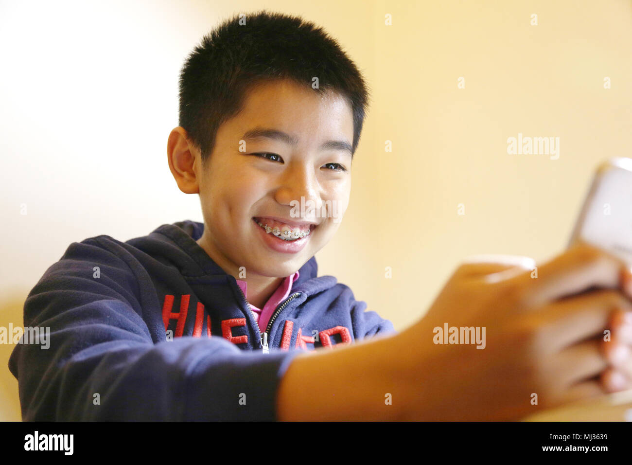 Cute teenager boy in room hi-res stock photography and images - Alamy