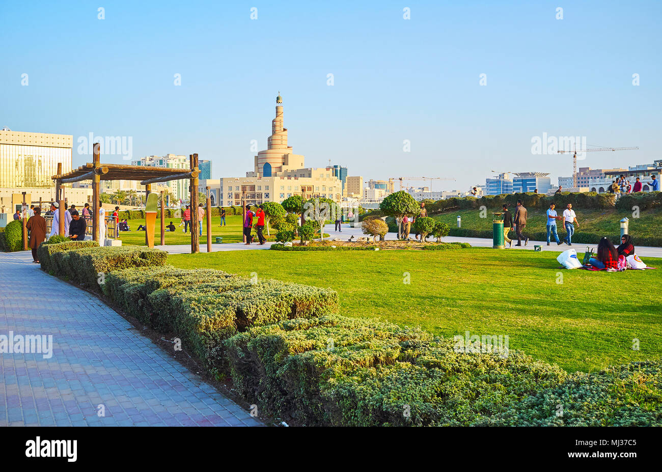 DOHA, QATAR - FEBRUARY 13, 2018: The crowded Souq Waqif park, families ...