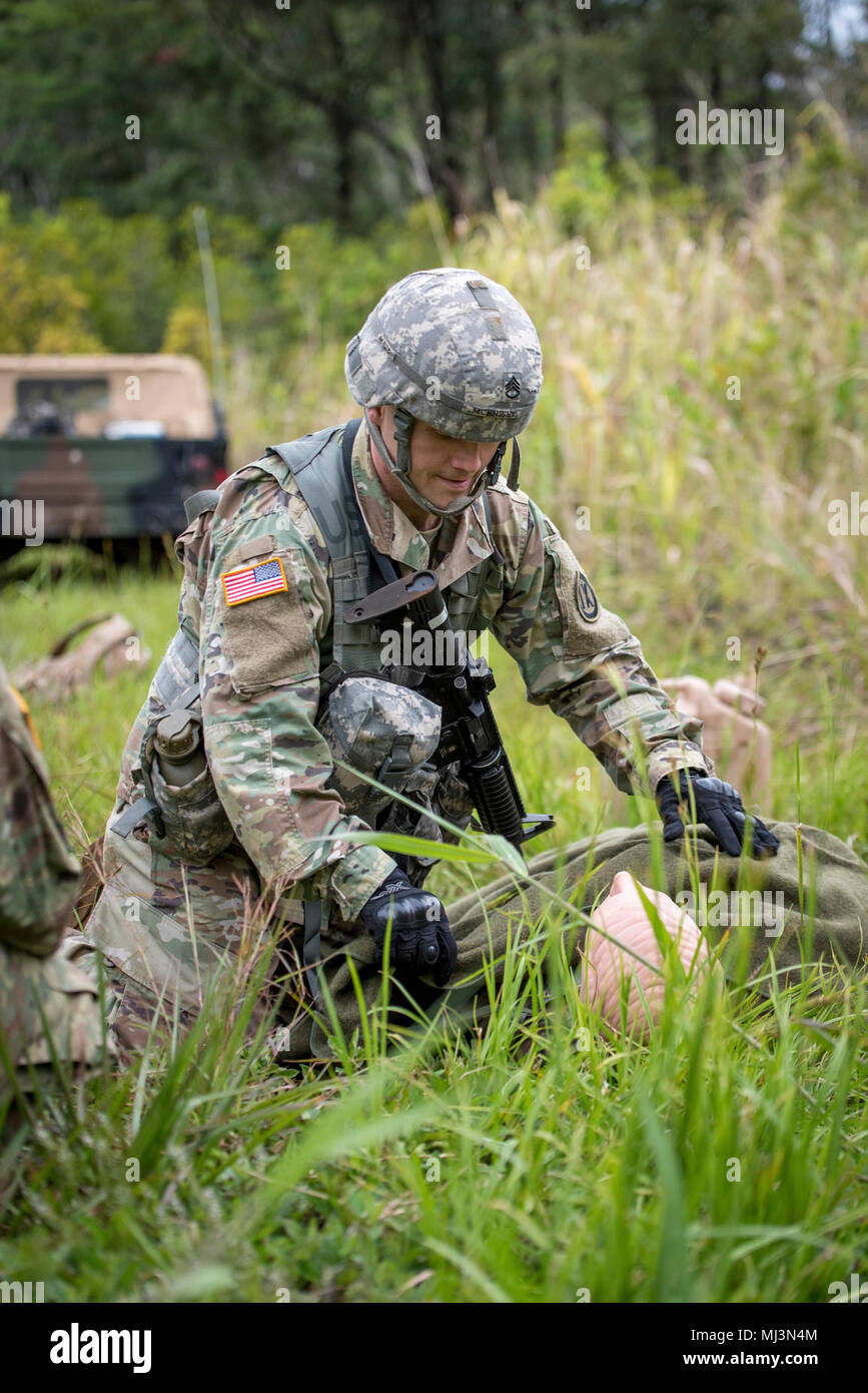 Staff Sgt. Bobby J. McKnight of the USARPAC-SU, Detachment K covers his ...