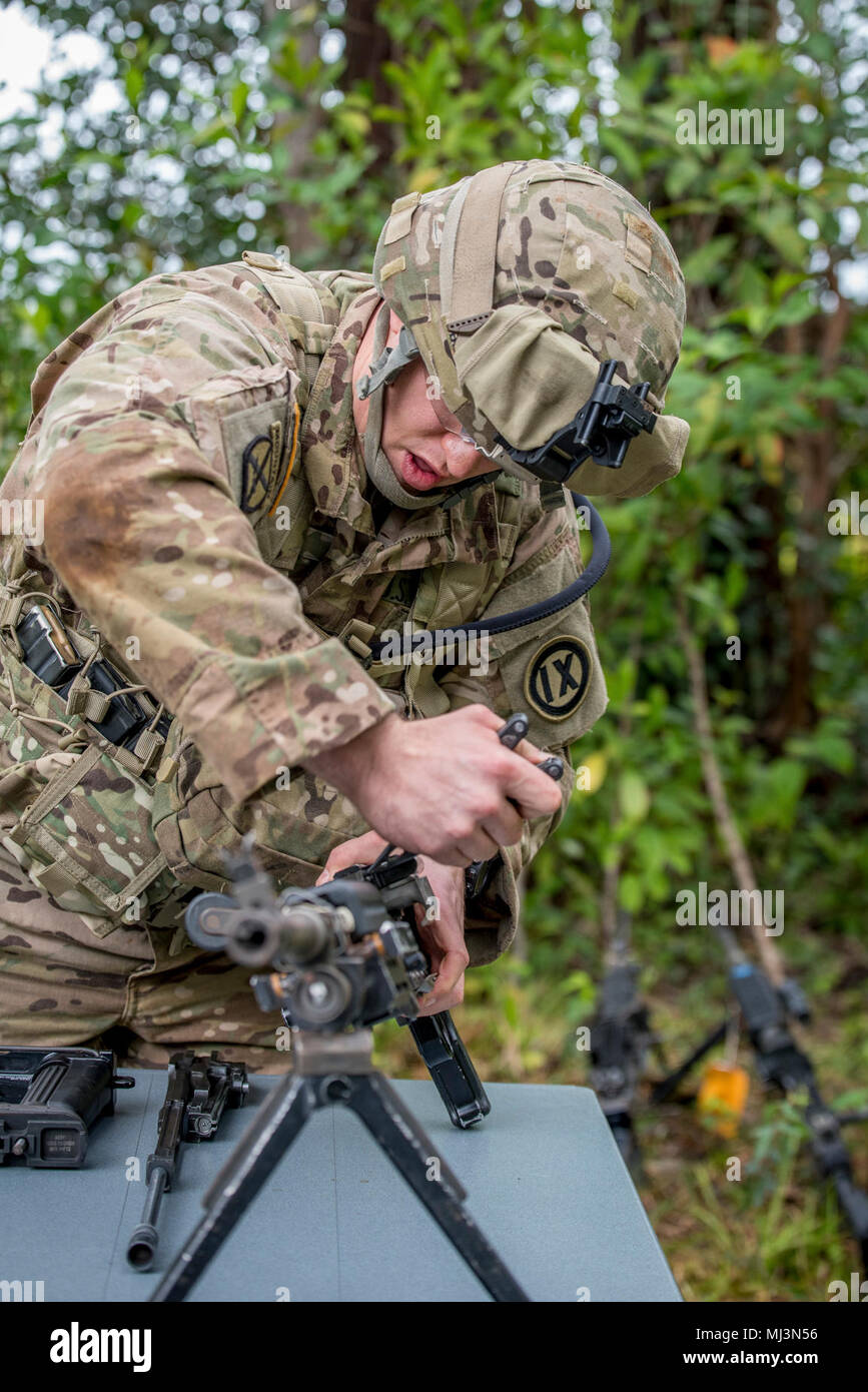 Sgt. Jeffrey O. Embry of the 411th Engineer Battalion reassembles a ...