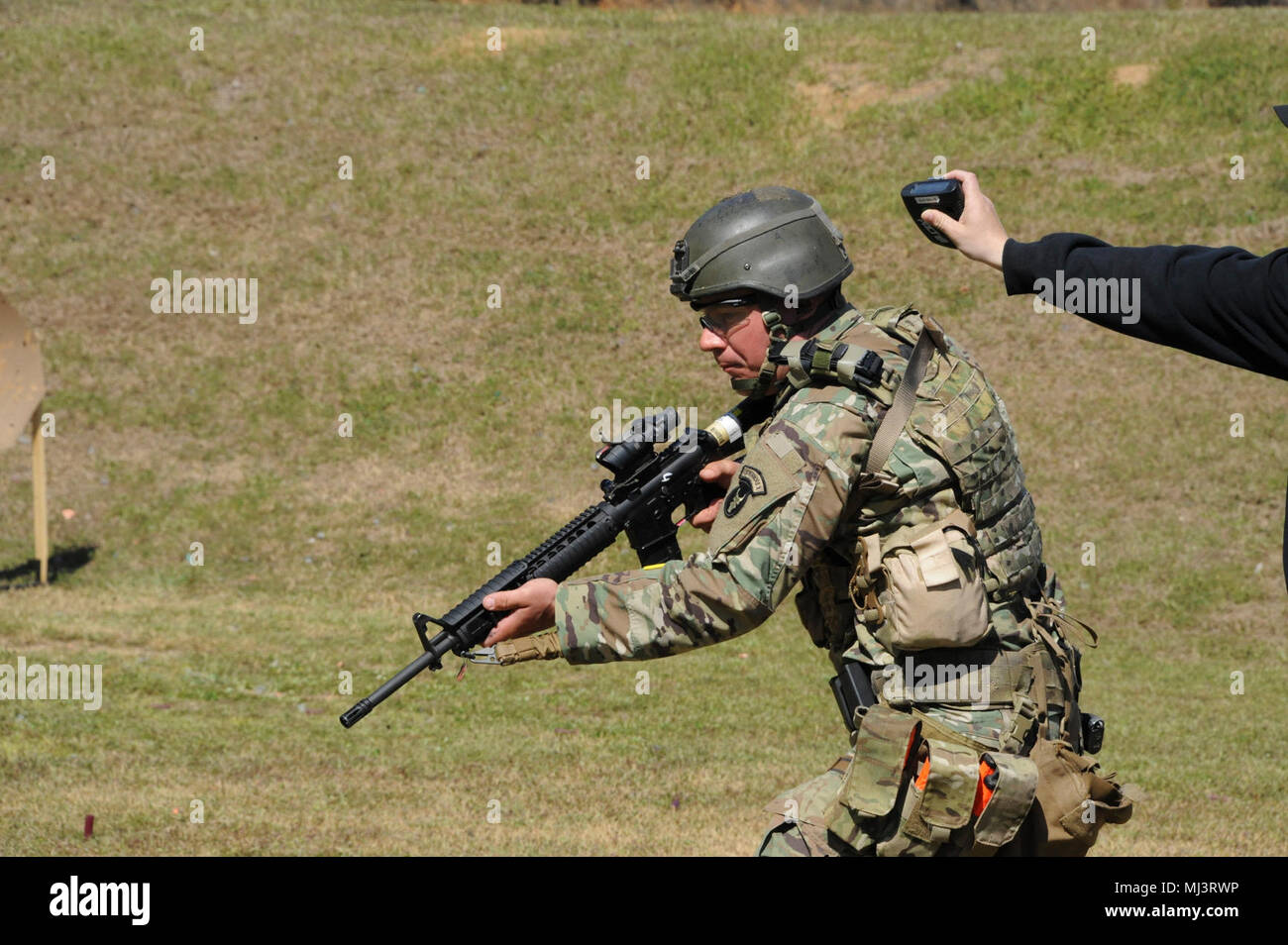 Sgt. Karl Johnk, Iowa Army National Guard, sprints to engage his first ...