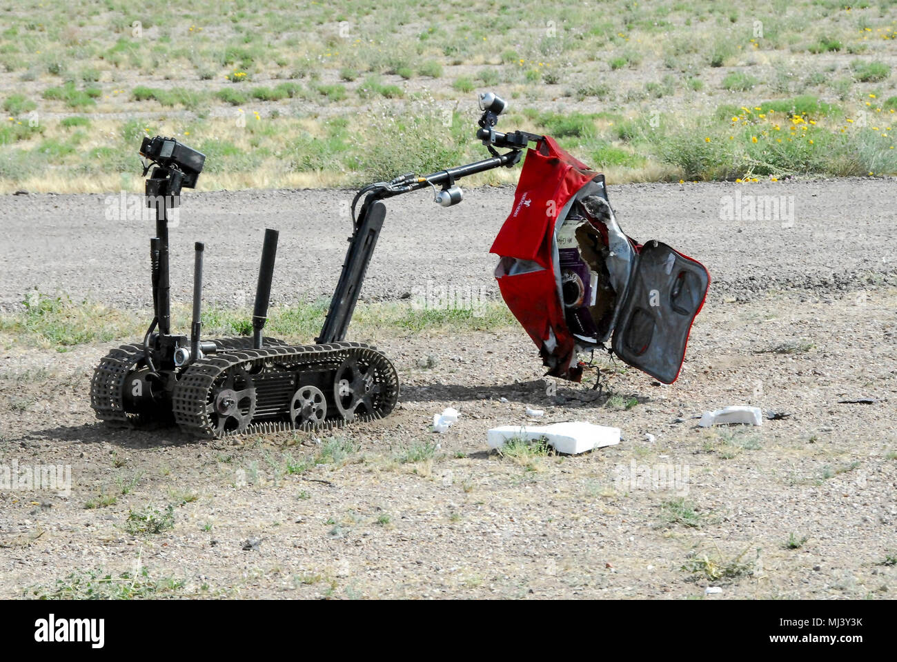A TALON explosive ordnance disposal robot is remotely controlled by an ...