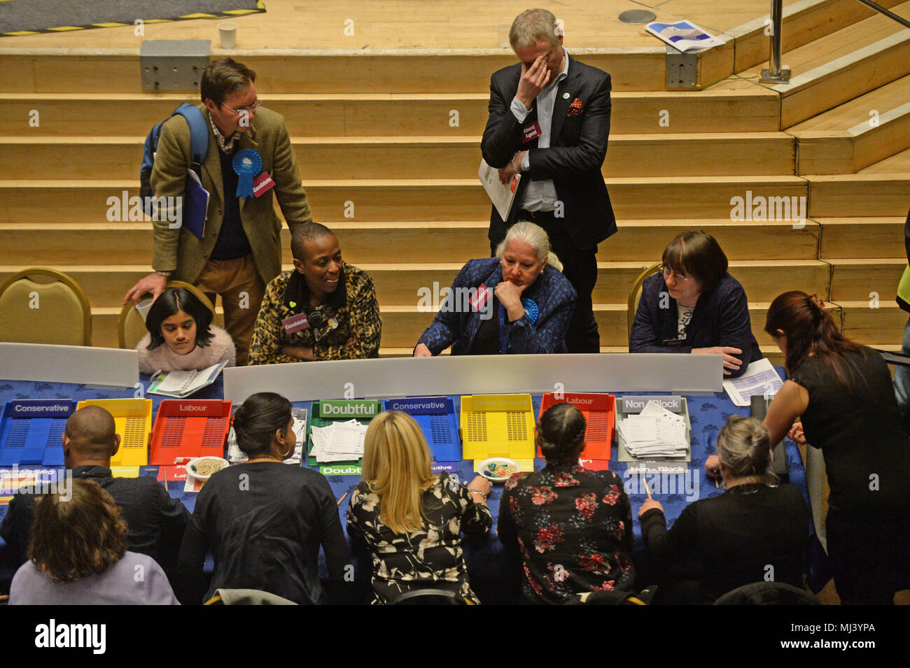 Count volunteers sort ballot papers at Kensington Town Hall, London as ...