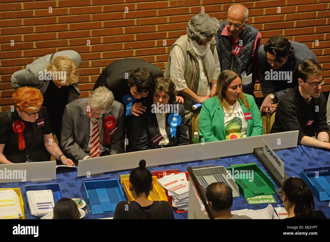 Count volunteers sort ballot papers at Kensington Town Hall, London as ...