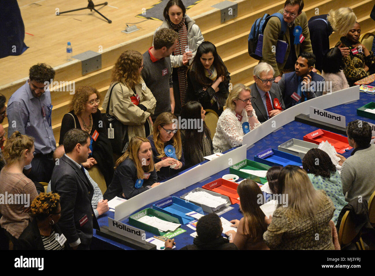 Count volunteers sort ballot papers at Kensington Town Hall, London as ...