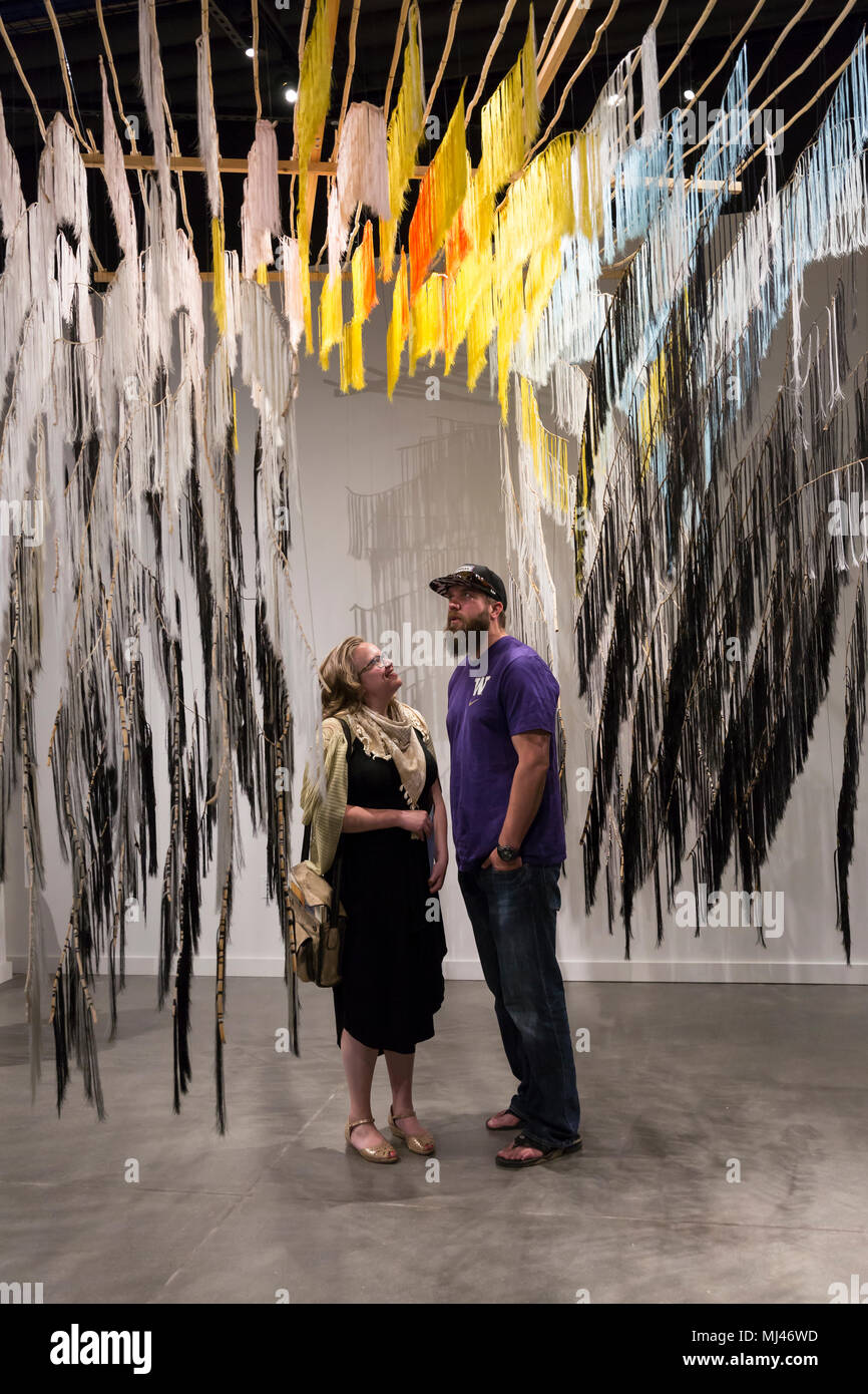 Seattle, Washington: A young couple enjoy the Northern Exposure exhibit ...
