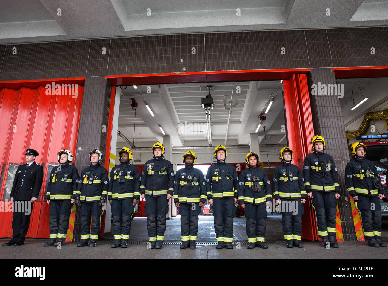 London, UK. 4th May, 2018. London Fire Brigade firefighters honour the ...