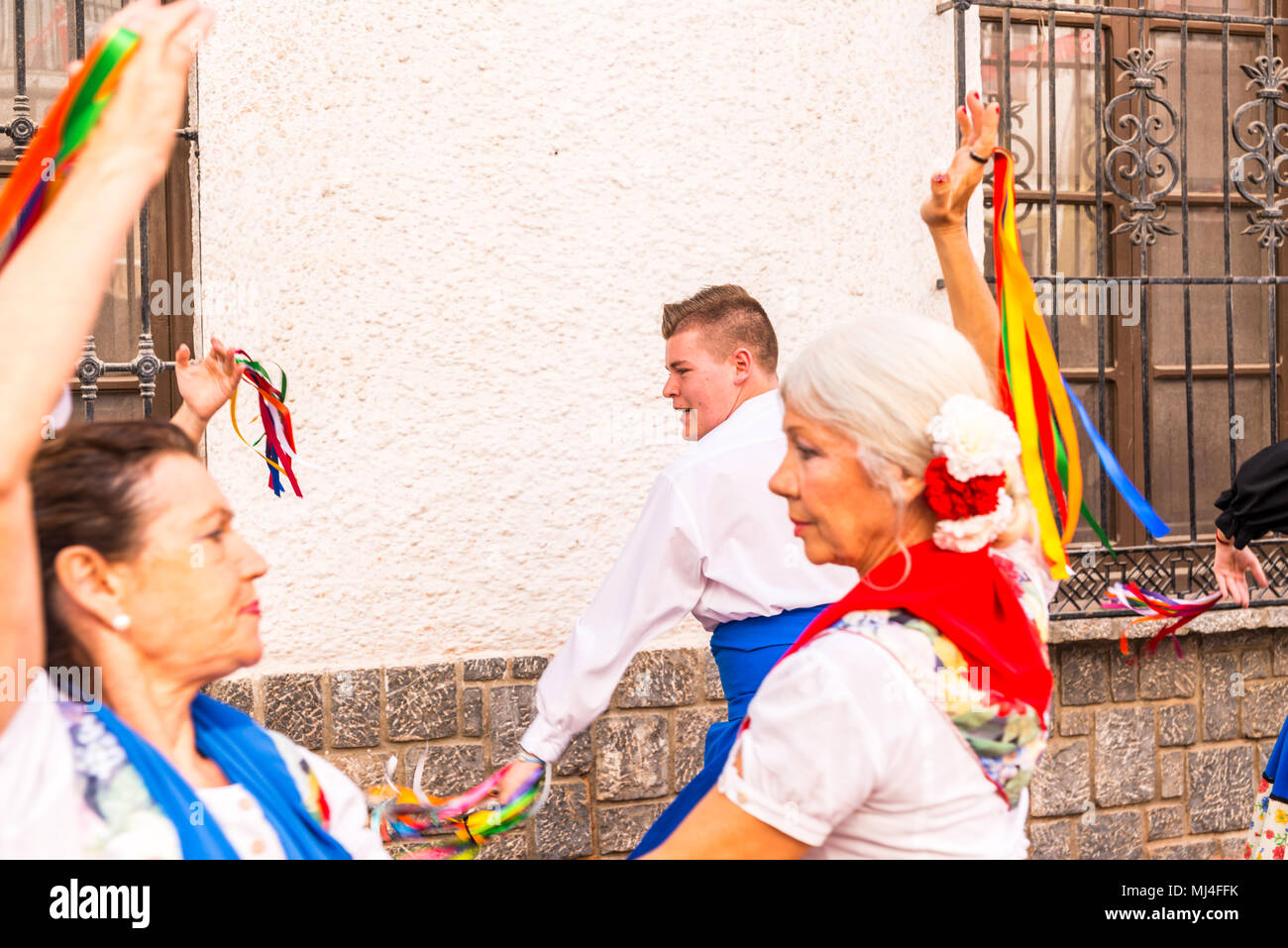 NERJA, SPAIN - MAY 04, 2018 people participating in a traditional folk ...