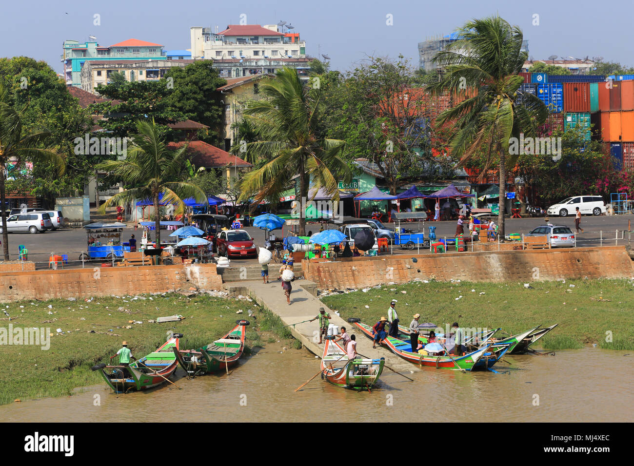 Riverboats and concrete loading ramp at Botahtaung Jetty on the Yangon ...