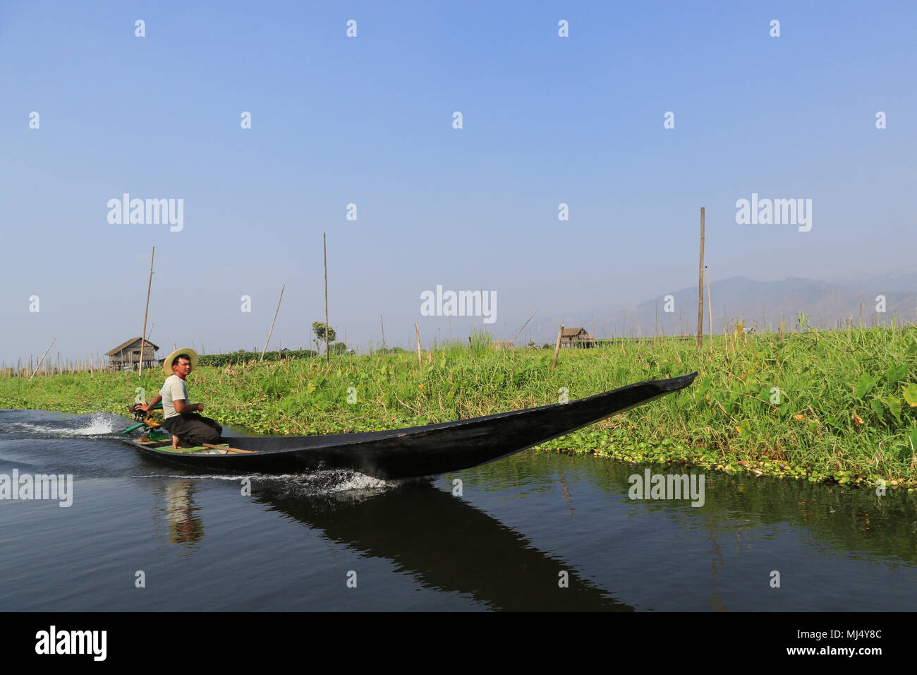 A boat passing by the floating gardens near Nampan at the south end of ...