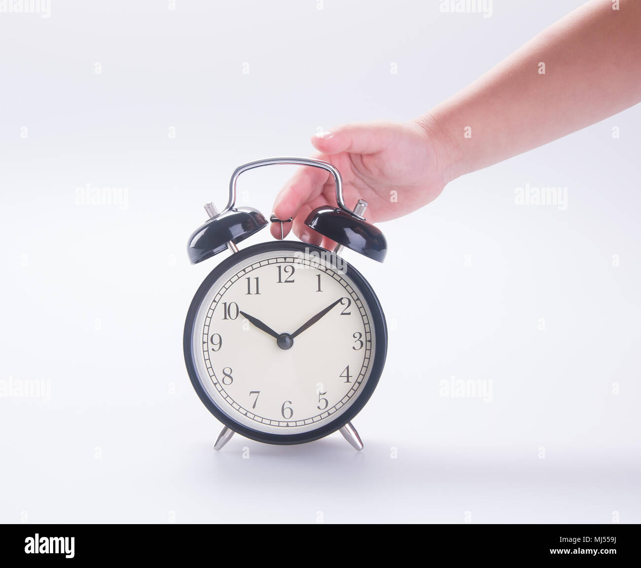 alarm clock with hand. alarm clock with hand on background Stock Photo ...