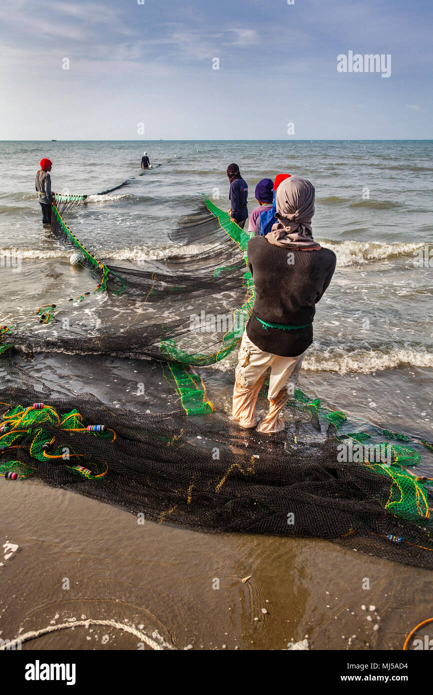 Men from the local fishing village lay out and haul in their near mile ...