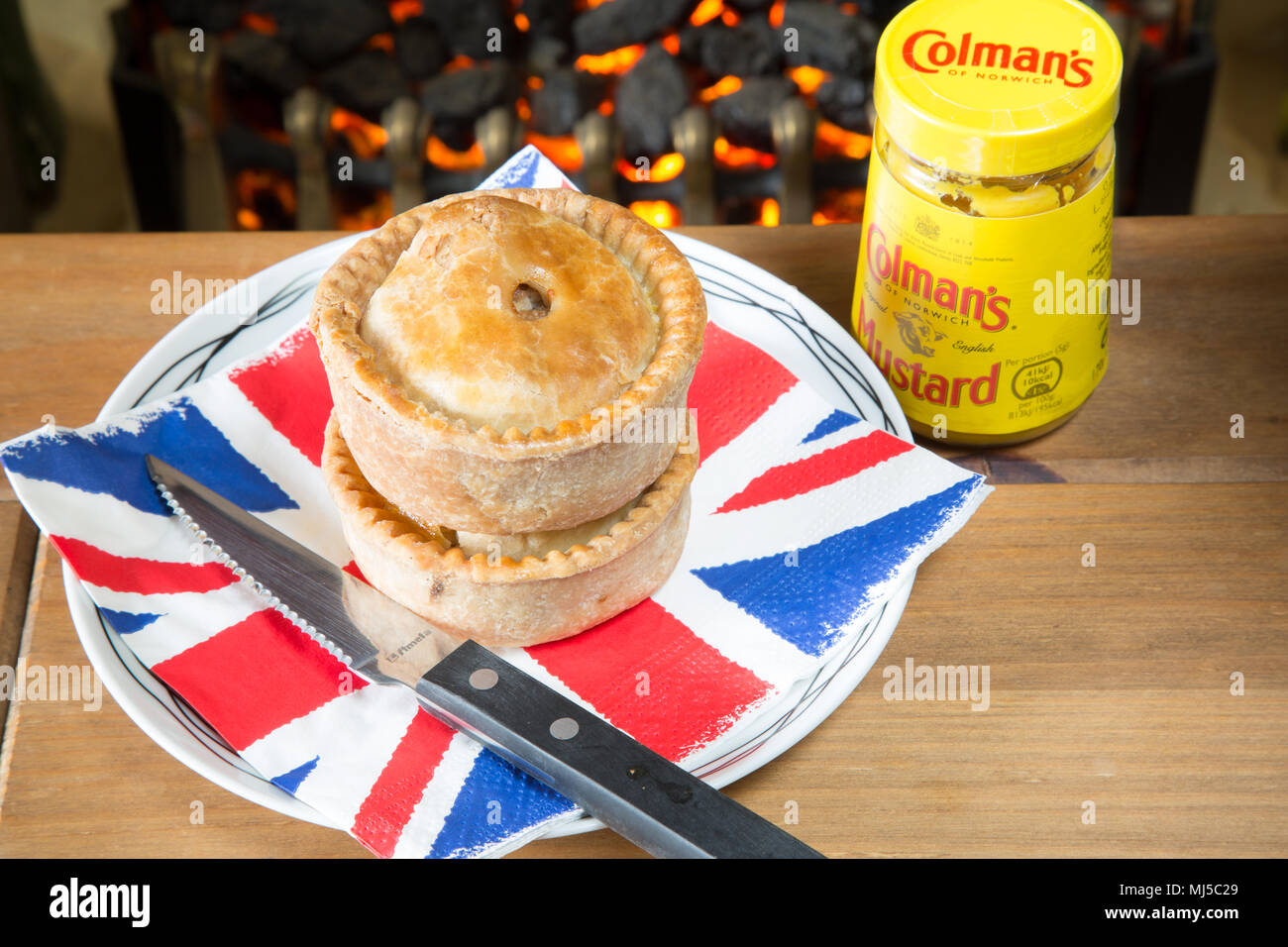 An English pub classic snack of Pork pie with Coleman's English mustard ...