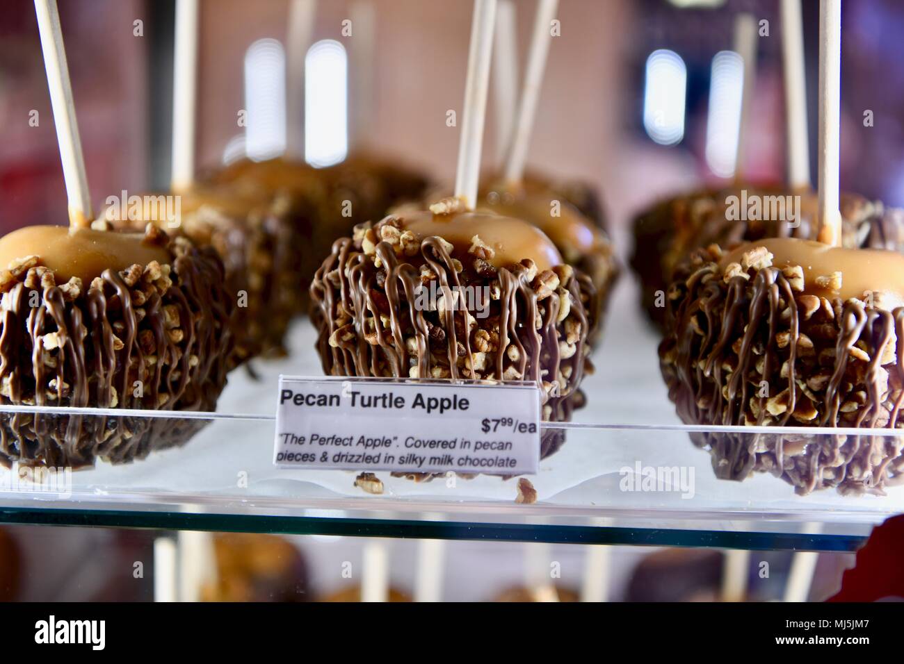 Pecan turtle candied apple Stock Photo - Alamy