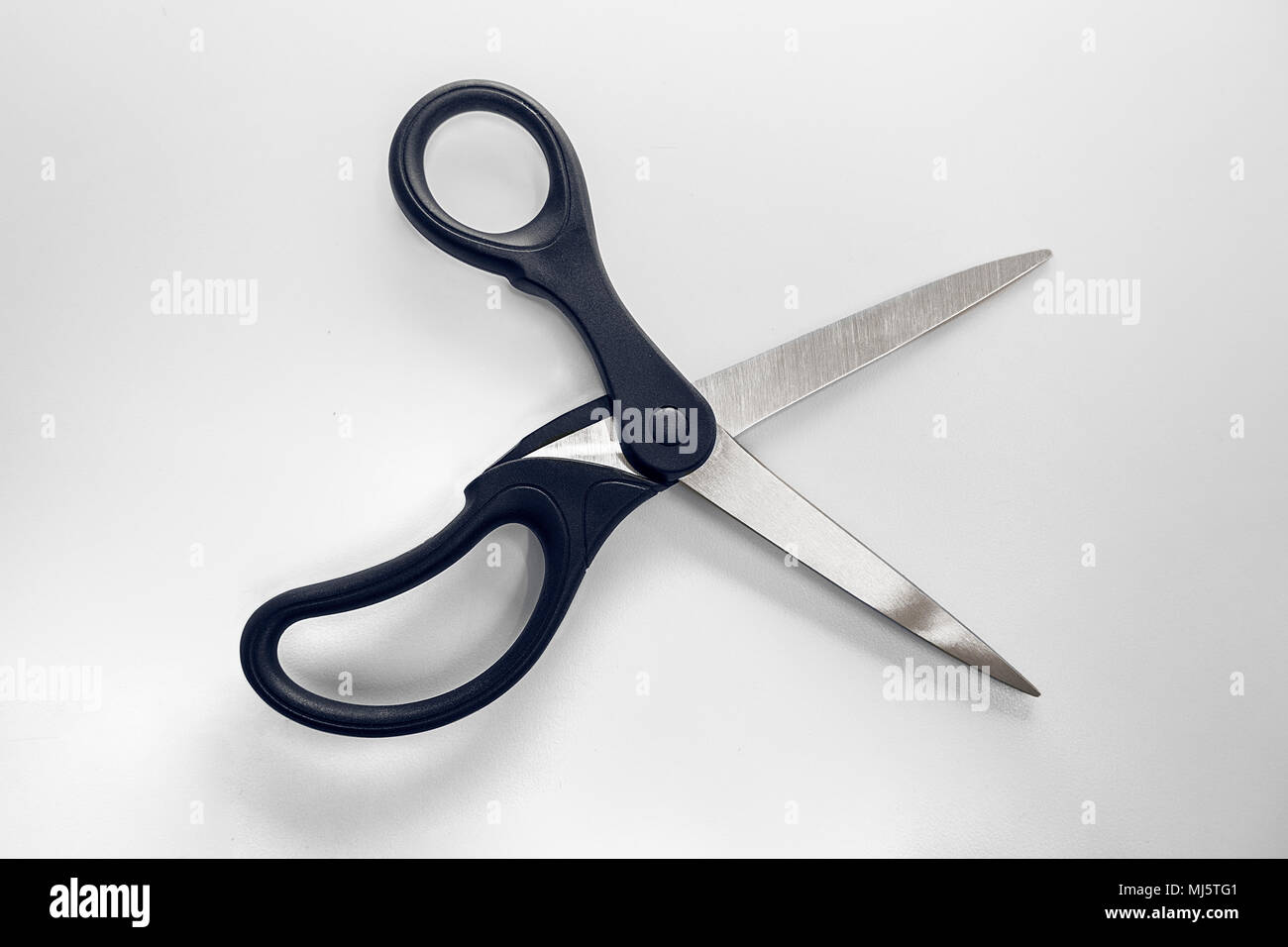 Open Black and steel scissors on white background Stock Photo - Alamy