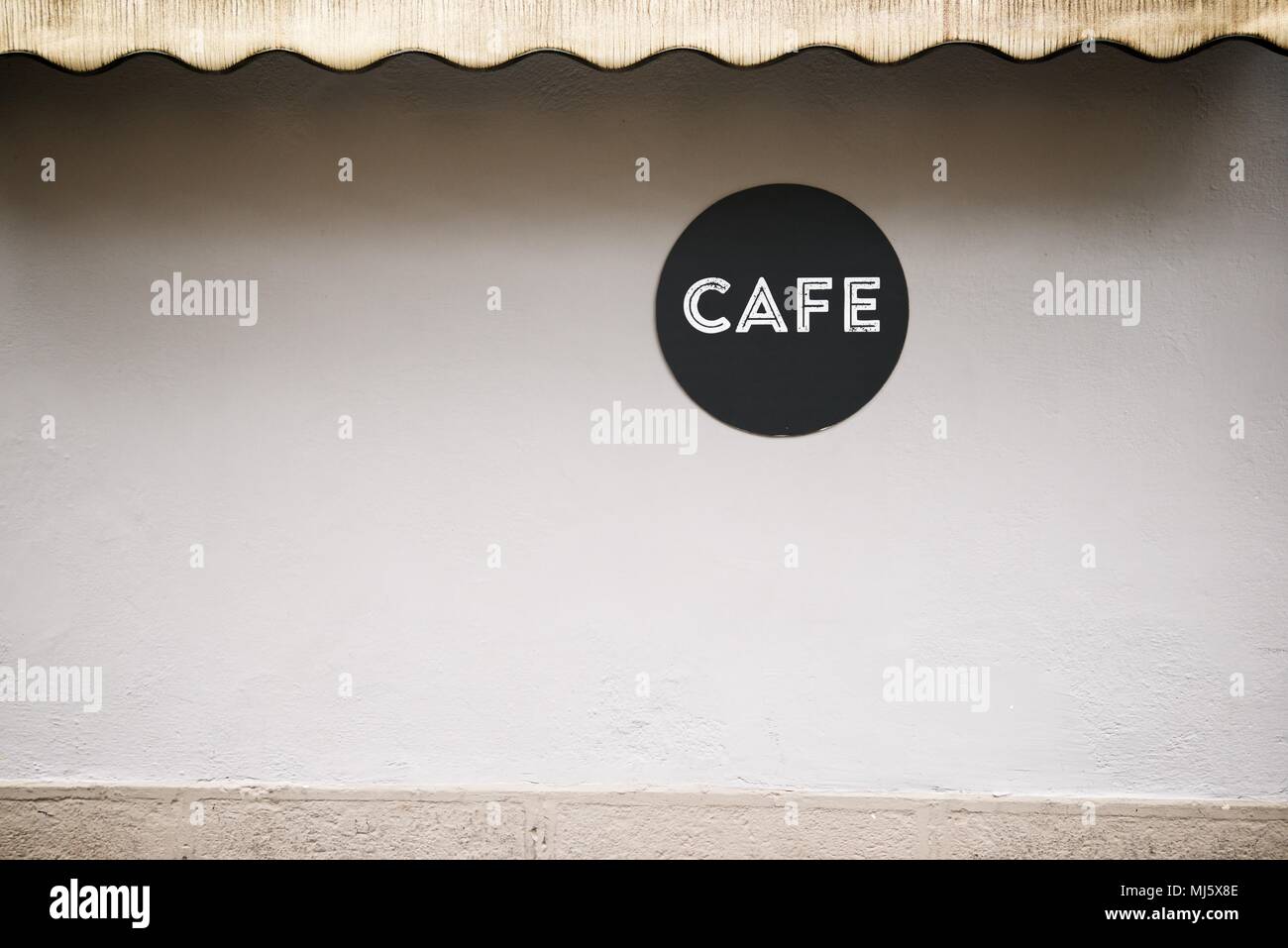 Cafe signboard on a white wall Stock Photo - Alamy