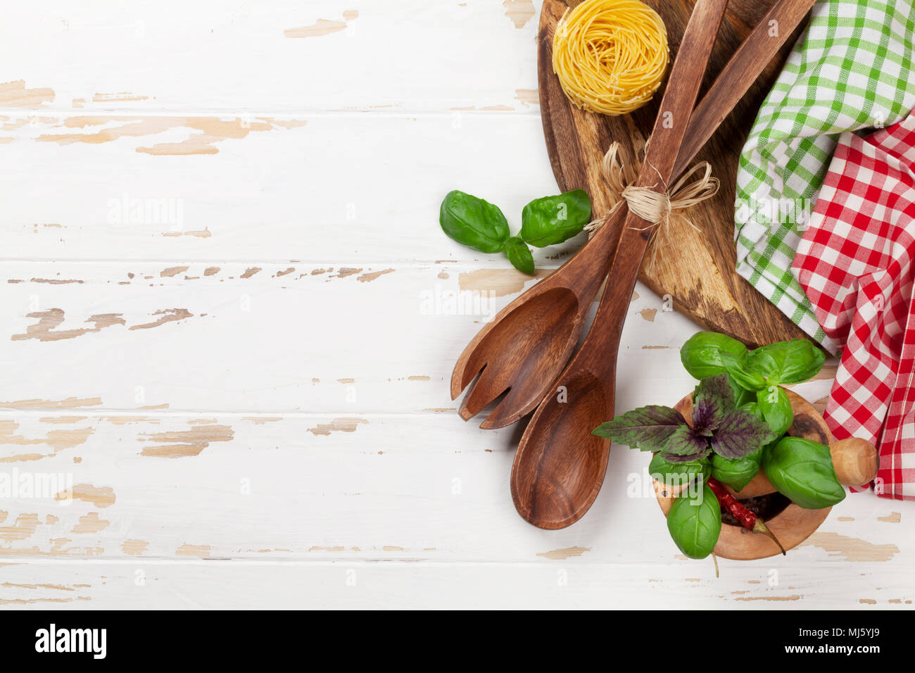Cooking table with utensils and ingredients on white wood. Top view ...