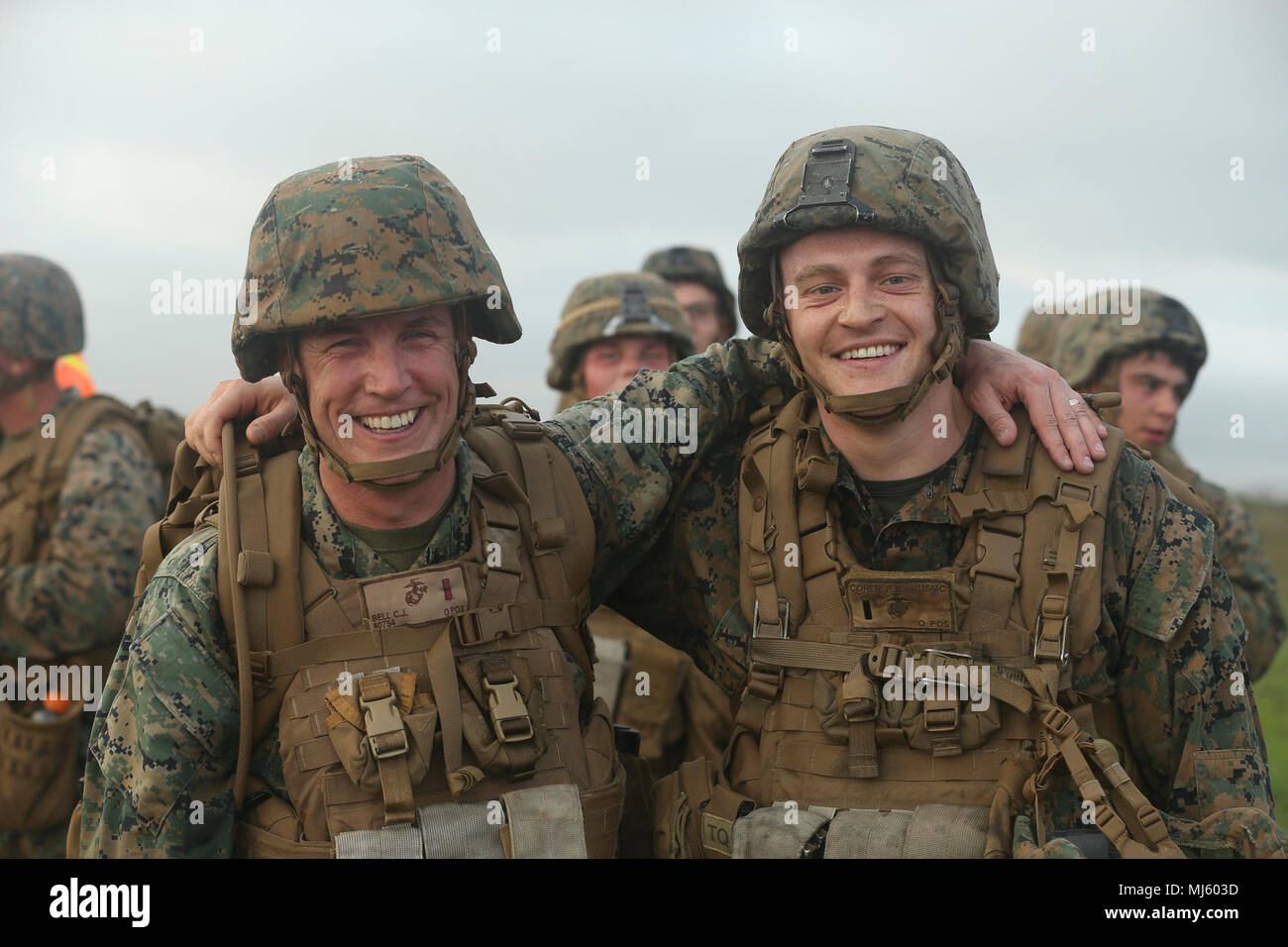 U.S. Marine Corps Chief Warrant Officer 3 Charles Bell, left, a utility ...
