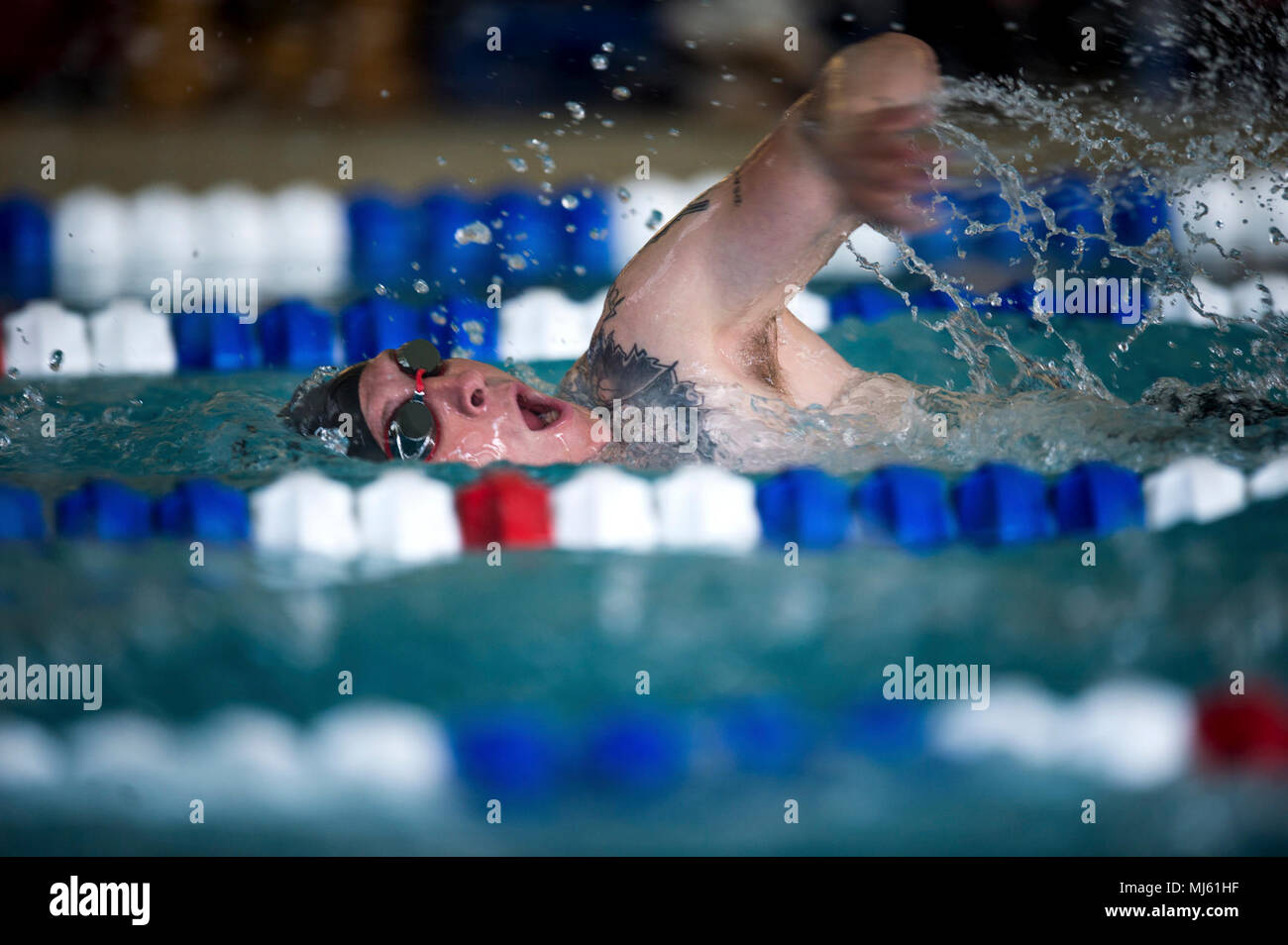 U.S. Marine Corps Staff Sgt. Jason Pacheco competes in the 4x50 meter ...