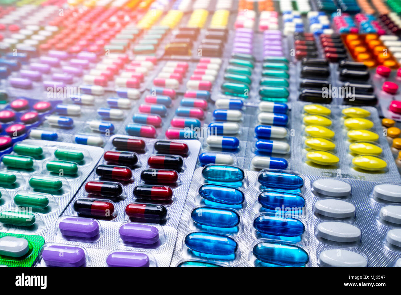 Colorful of tablets and capsules pill in blister packaging arranged ...
