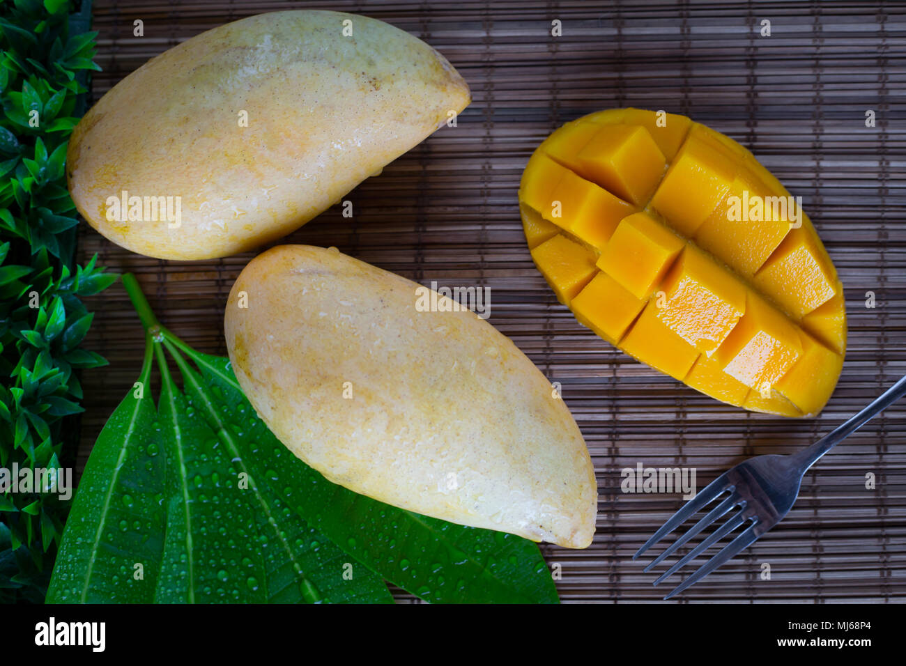 Mango on stick hi-res stock photography and images - Alamy