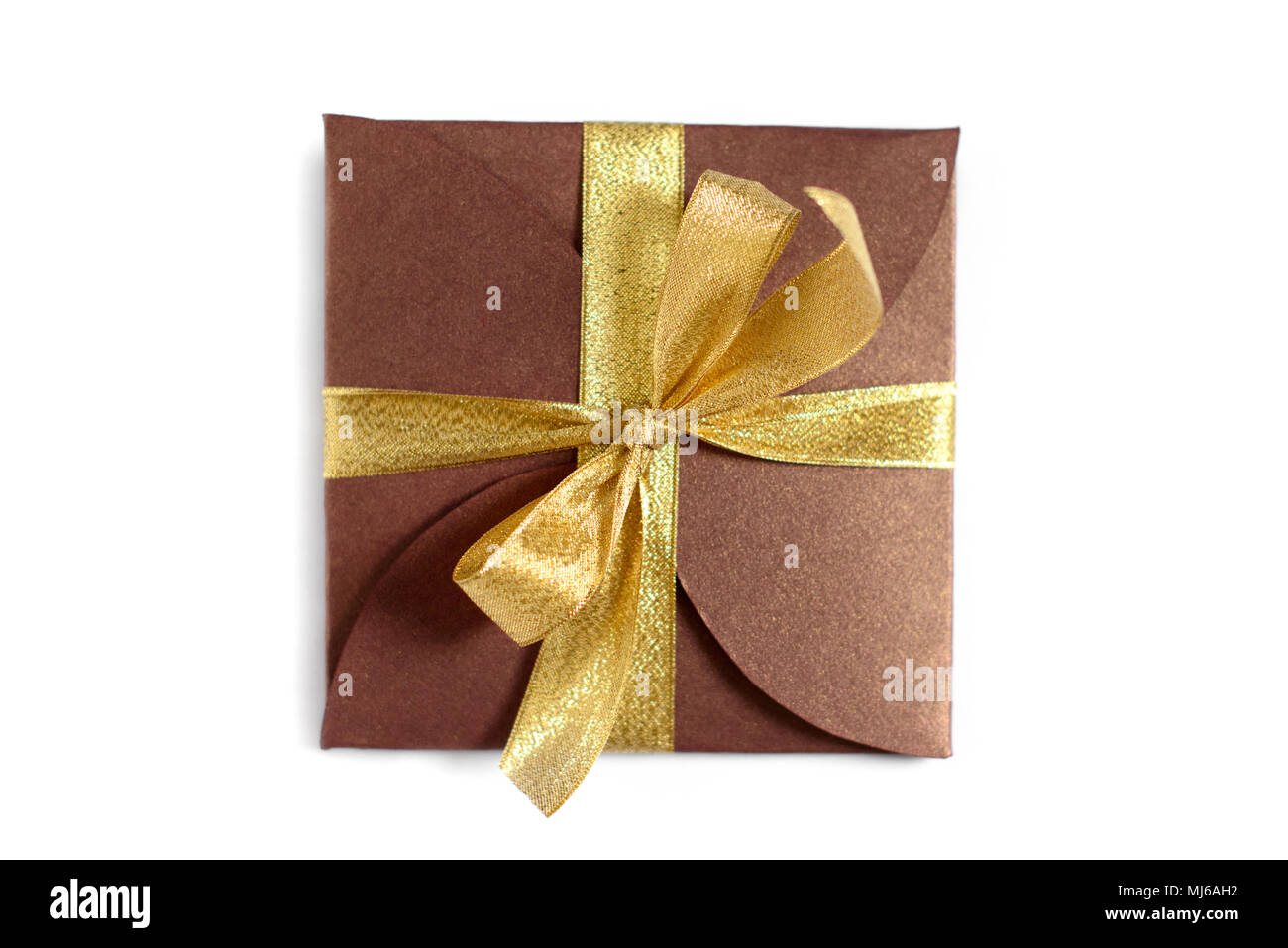 Christmas gift wrapped in brown paper with the bow top view isolated on ...