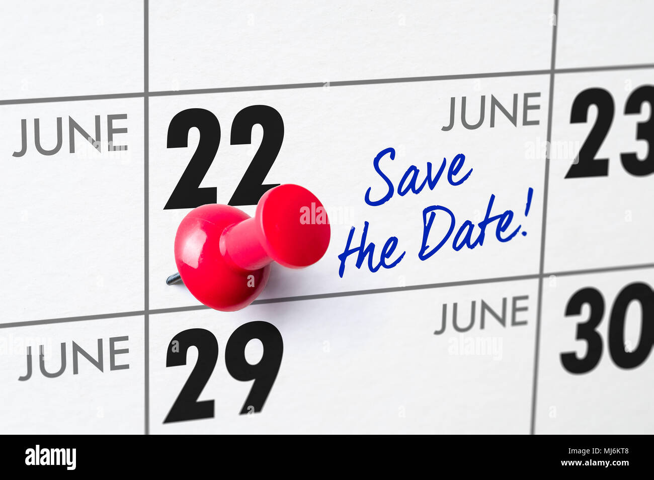 Wall calendar with a red pin - June 22 Stock Photo - Alamy