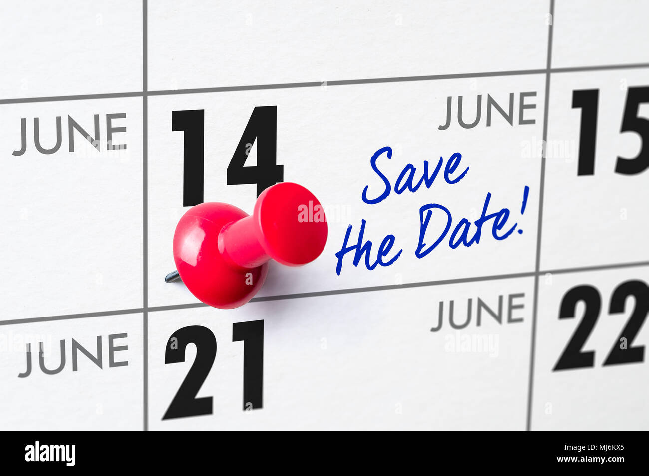 Wall calendar with a red pin - June 14 Stock Photo - Alamy