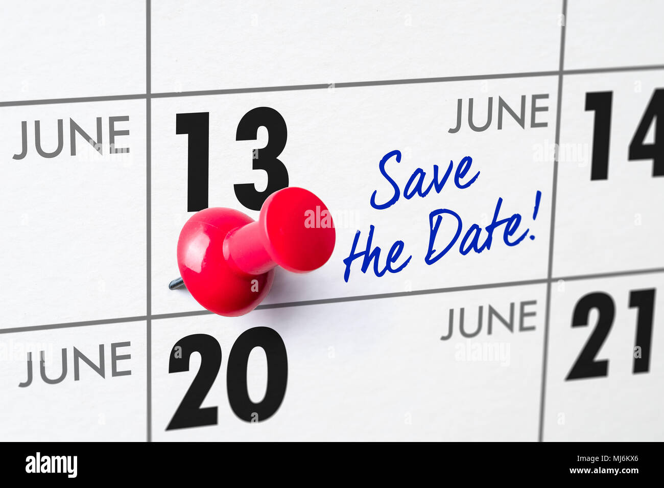 Wall calendar with a red pin - June 13 Stock Photo - Alamy