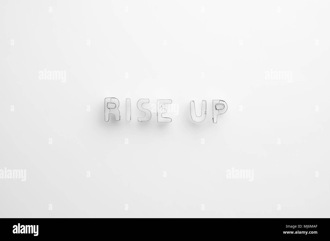 Rise up word over white background, top view Stock Photo - Alamy