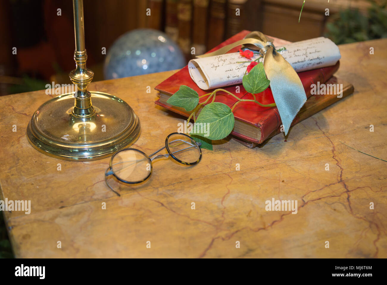 Ancient Manuscript Rolled Up with Golden Ribbon, Aged Books, Green ...