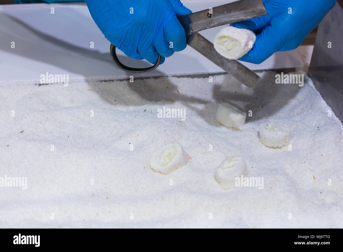 Turkish delight cutting.cut with special scissors. covered with coconut ...