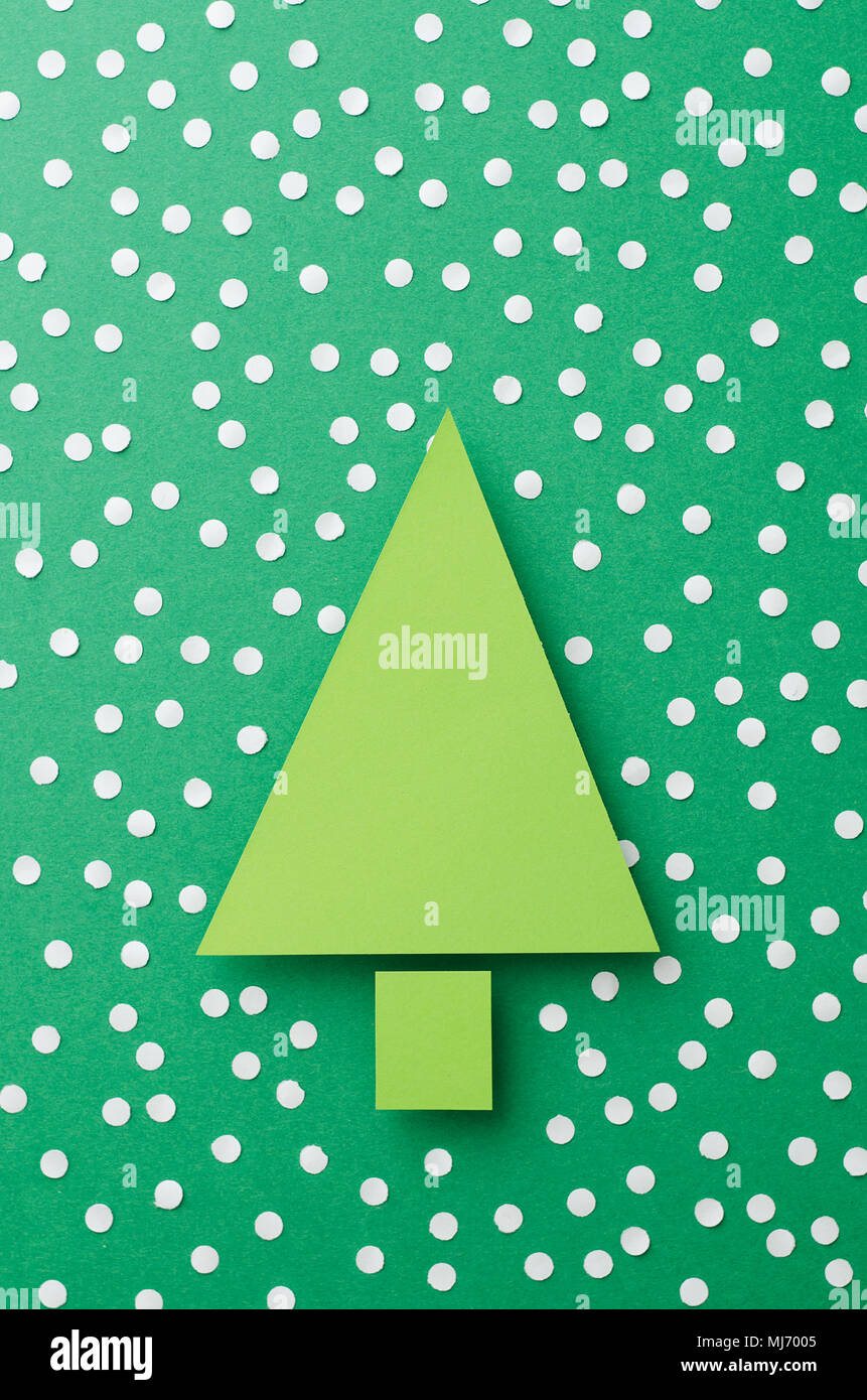 Paper Christmas Tree and snow cut from green paper over green ...