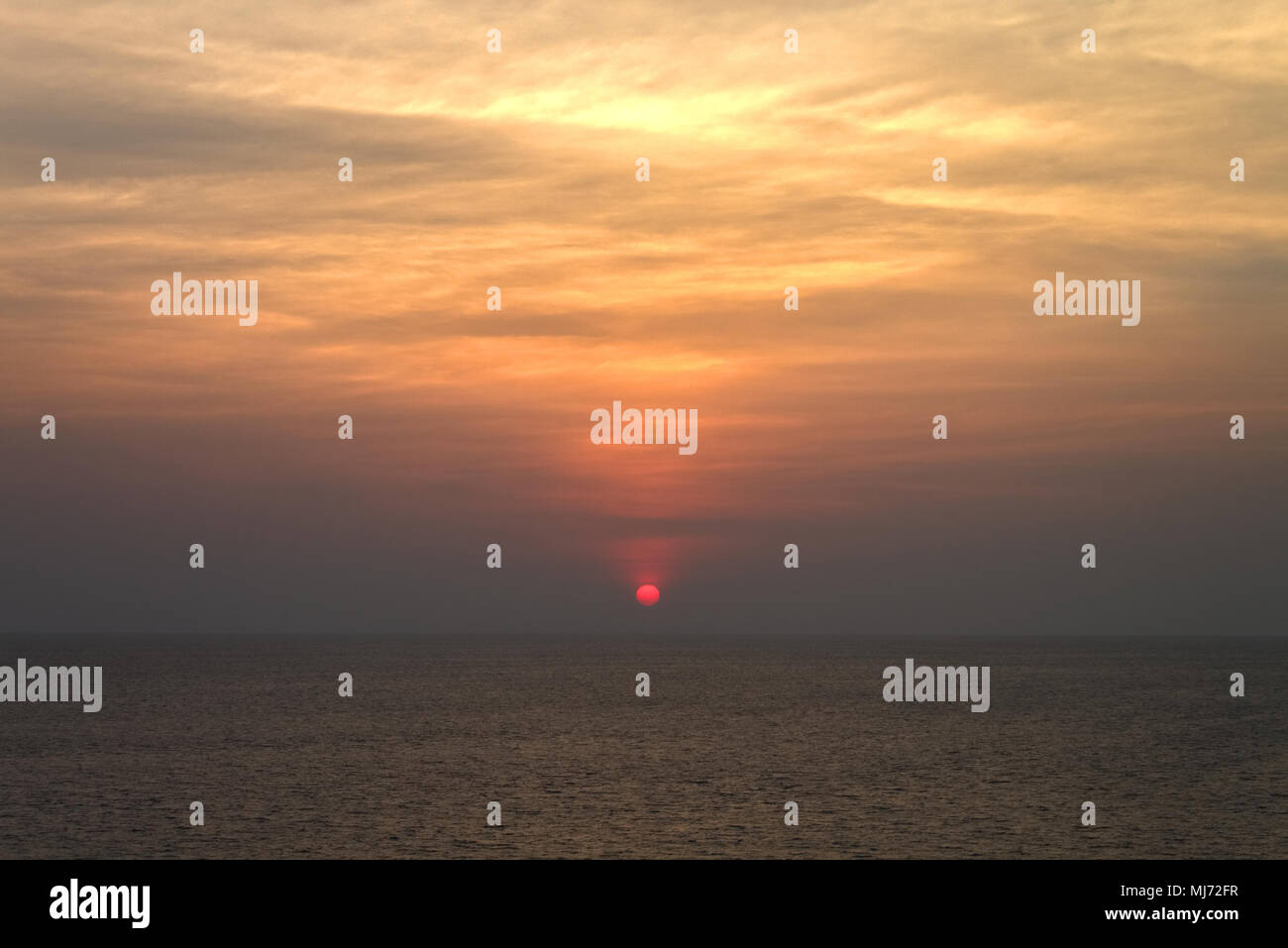 A beautiful sunset, taken off the coast of Kerala, India in the Indian ...
