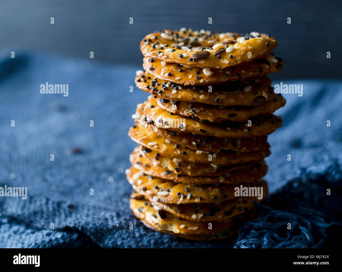 Crackers with mix seeds over dark rustic background Stock Photo - Alamy