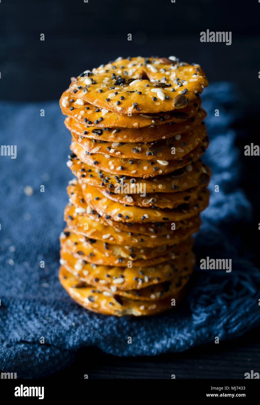 Crackers with mix seeds over dark rustic background Stock Photo - Alamy