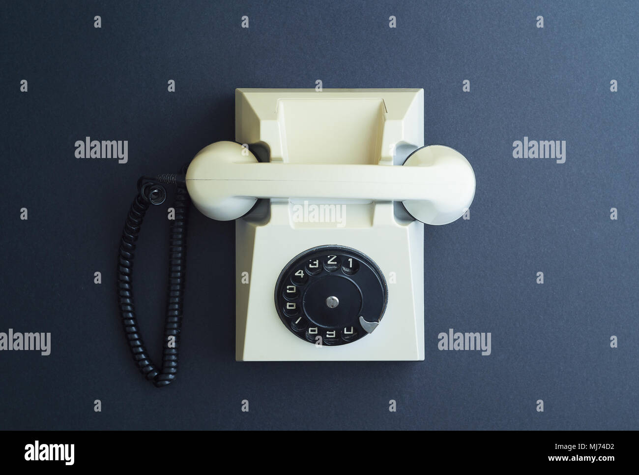 Retro rotary phone over black background, above view Stock Photo - Alamy