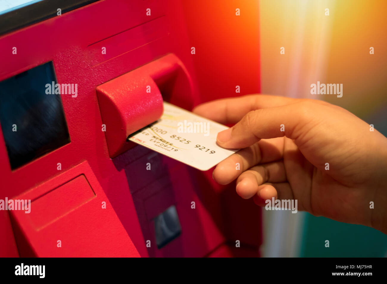 hand put card in ATM and city, concept as finance, banking and capital ...