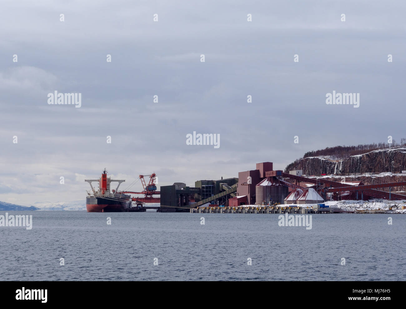 Norway Narvik, Cargo ship loading iron ore at the Port of Narvik on a ...