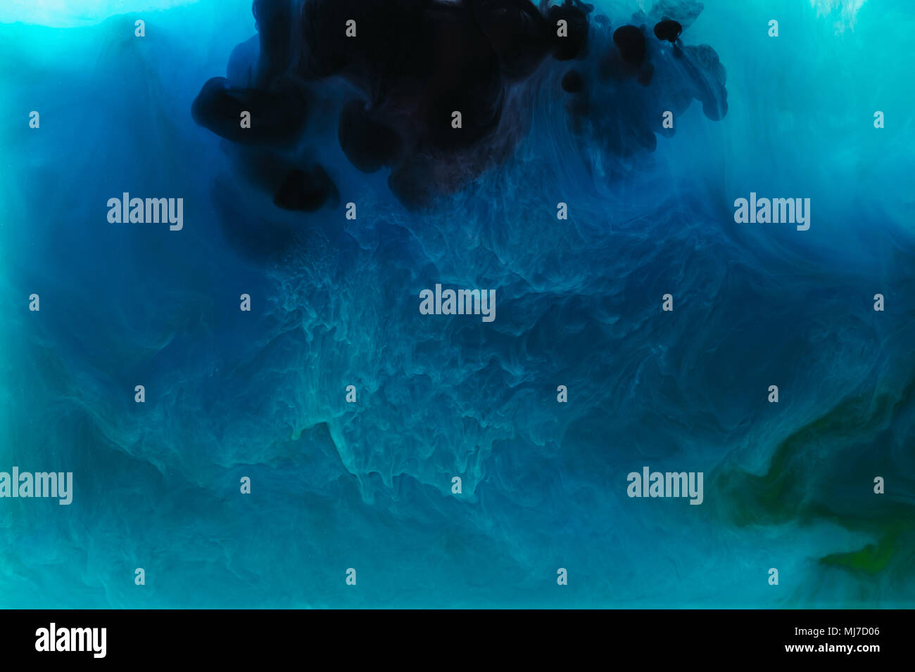 full frame image of mixing of blue, black, turquoise and green paints ...